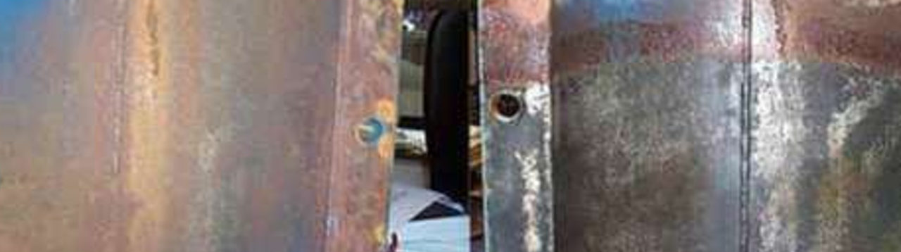 Magnetite forms in water bearing steel pipes and so reduce the corrosion